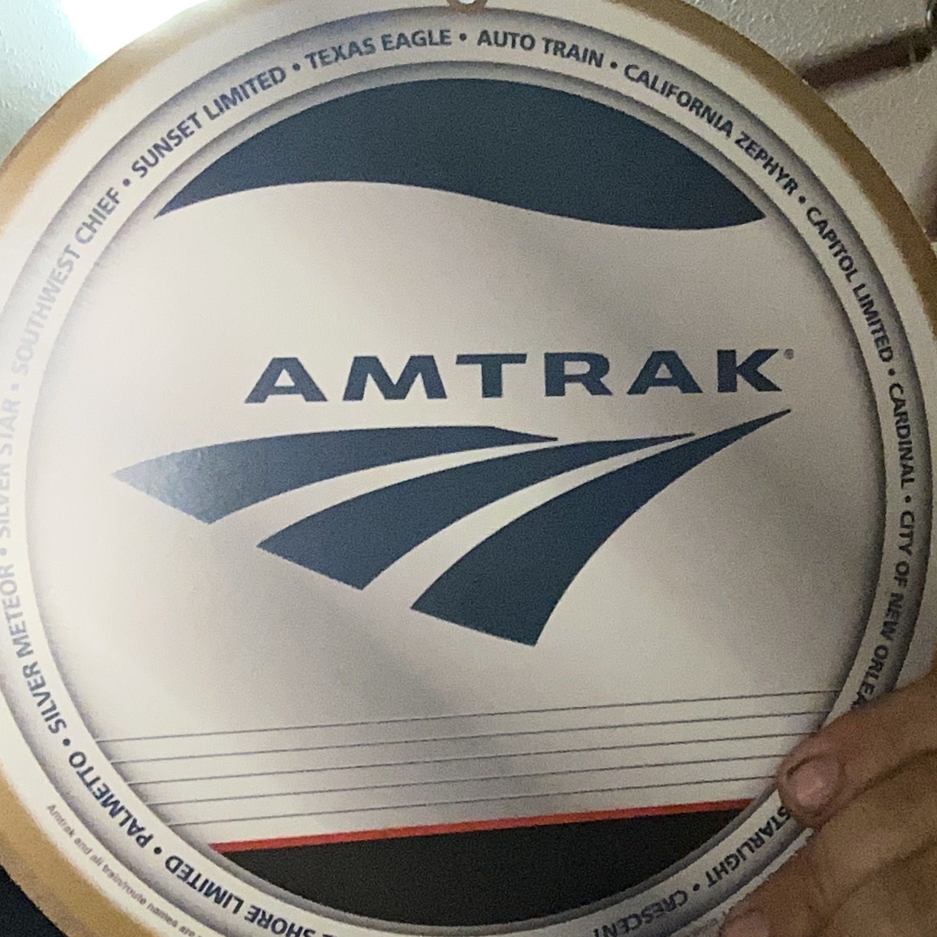 Round wooden railway signs Amtrak | Whitewater Valley Railroad